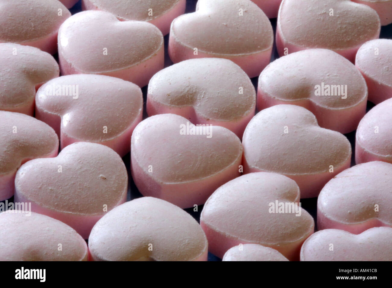 Pink heart sweets hi-res stock photography and images - Alamy