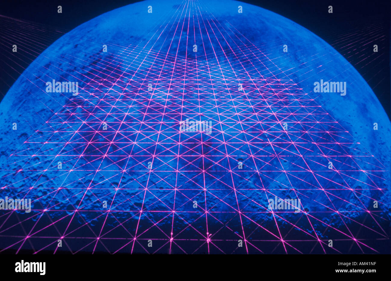Space special effects composite with blue moon and grid of laser light ...