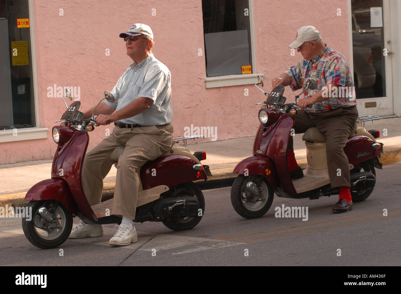 Seniors driving a vespa Stock Photo - Alamy