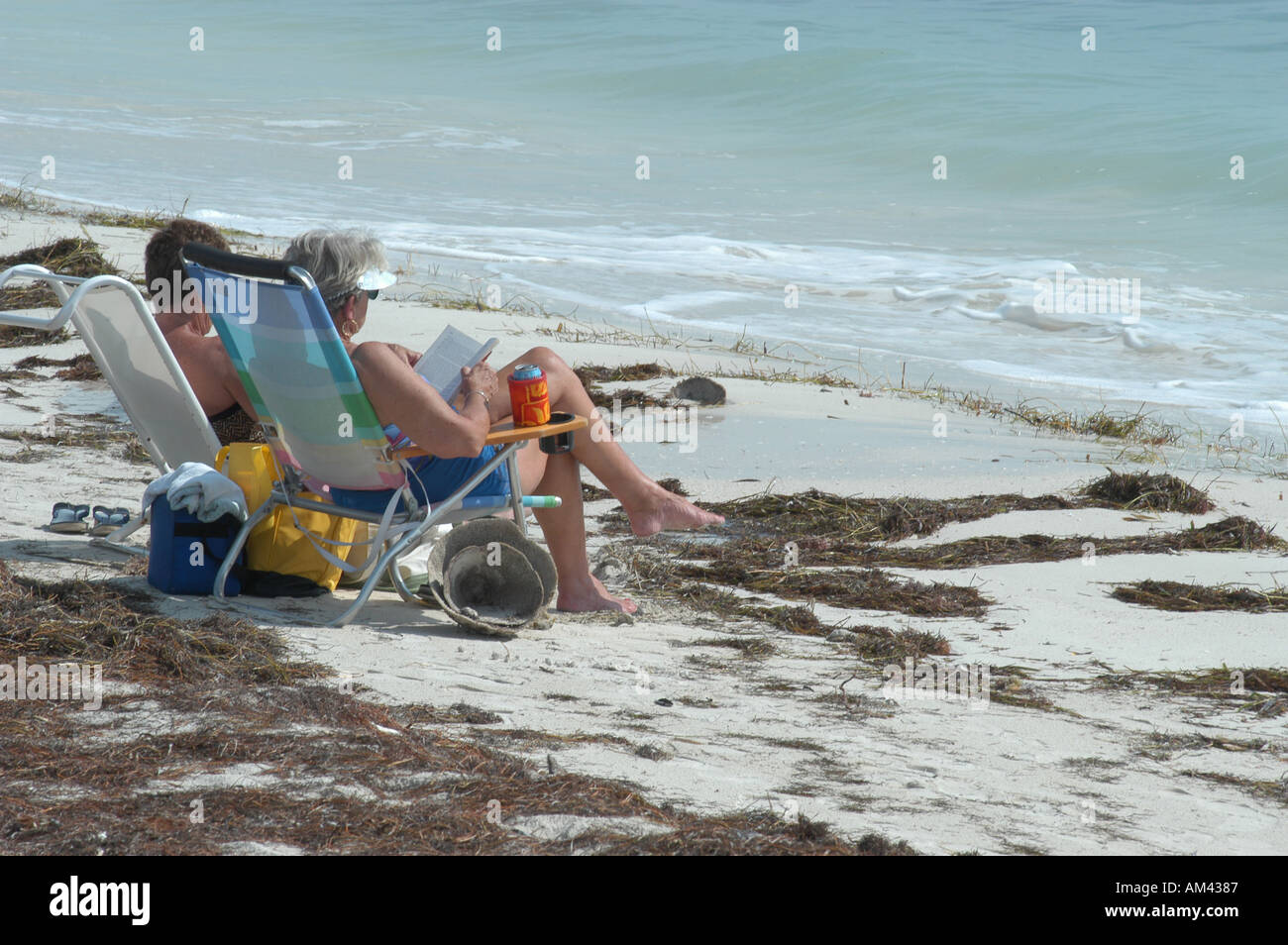 People resting on a beach Stock Photo - Alamy