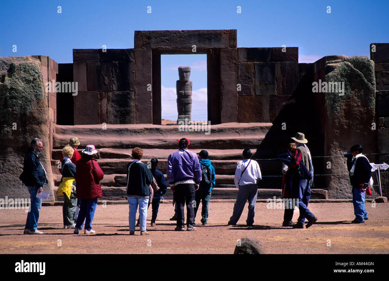 Tourist at Kalassasaya Temple entrance and Ponce Monolith. Tiahuanaco ...