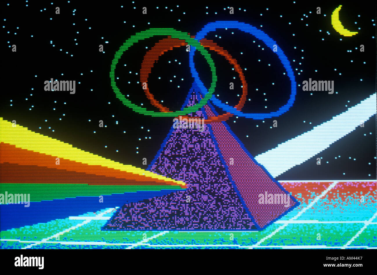 Early computer graphic of a pyramid with rays of rainbow light from ...