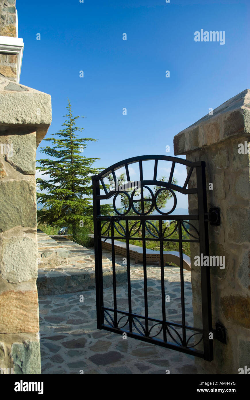 ornate metal gate in stone wall Stock Photo - Alamy
