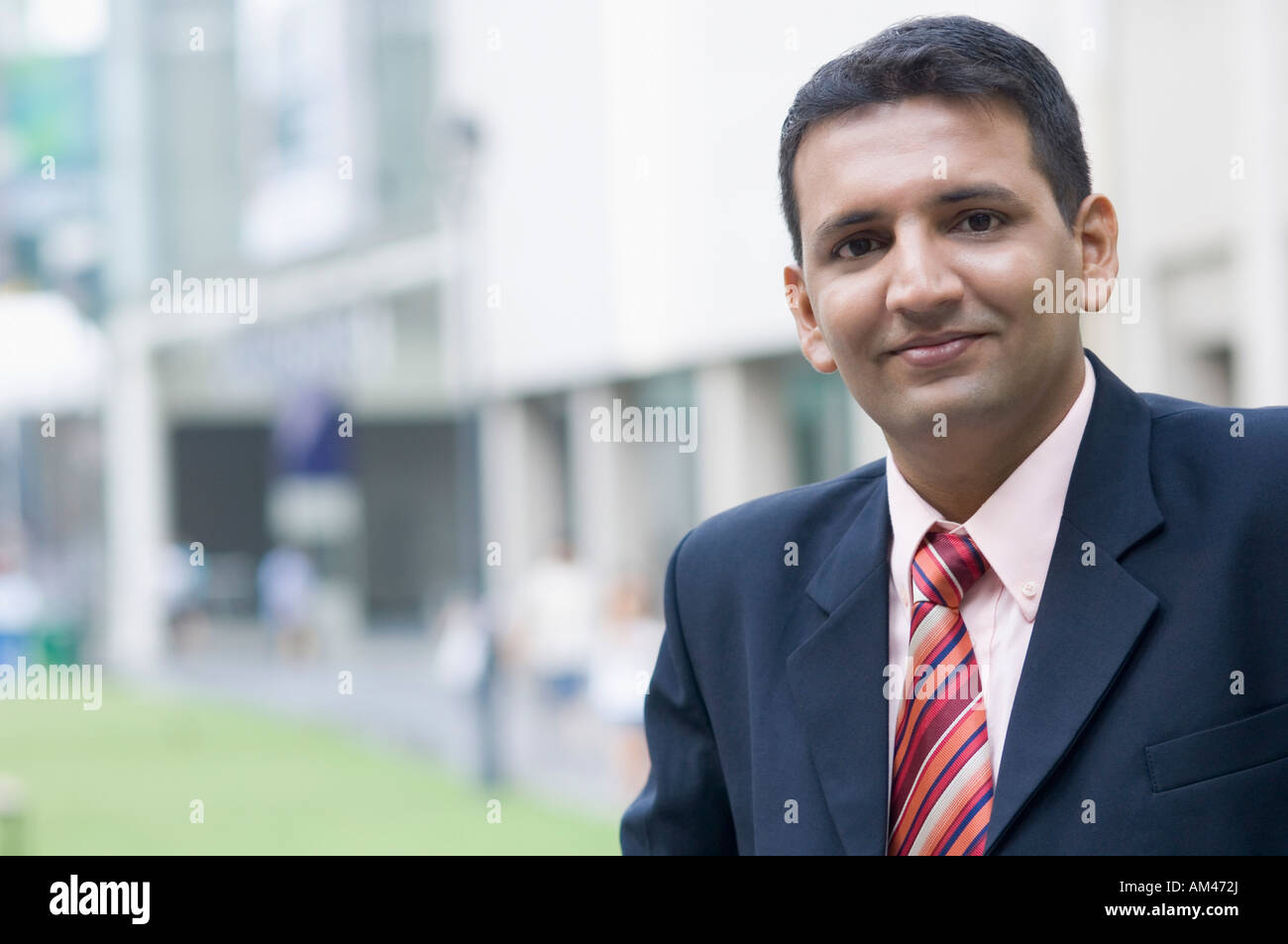 Portrait of a businessman smiling, Singapore Stock Photo - Alamy