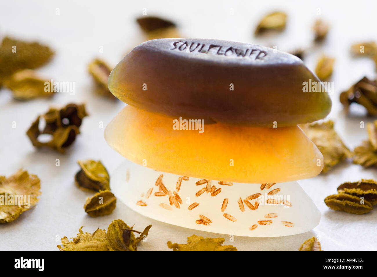 Close-up of a stack of soaps with herbs Stock Photo - Alamy