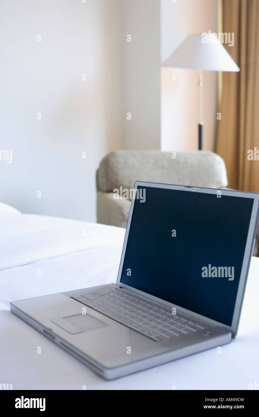 Laptop on the bed in a hotel room Stock Photo - Alamy