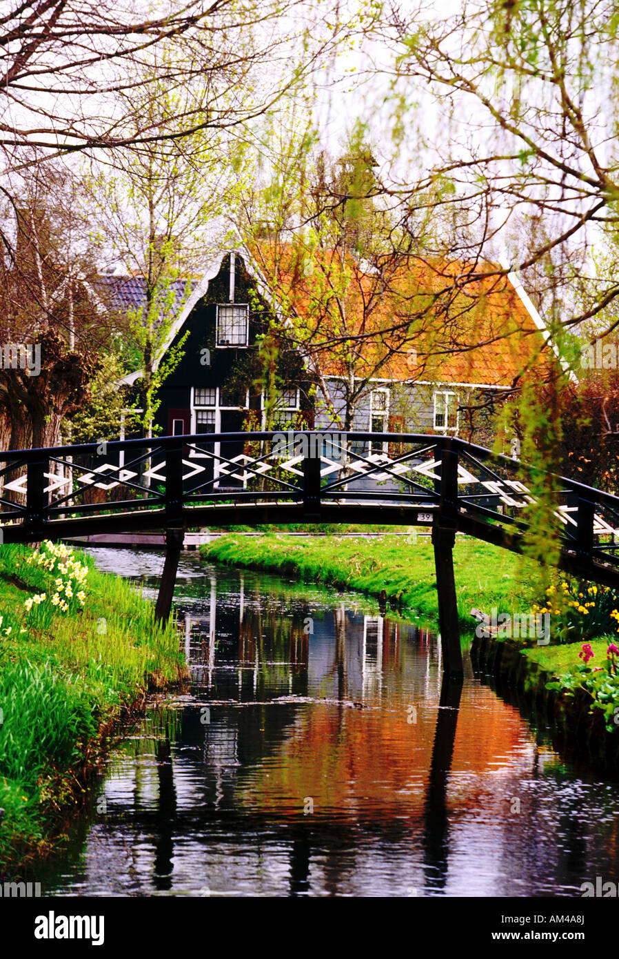 wooden bridge over a canal and typical dutch houses in the model ...
