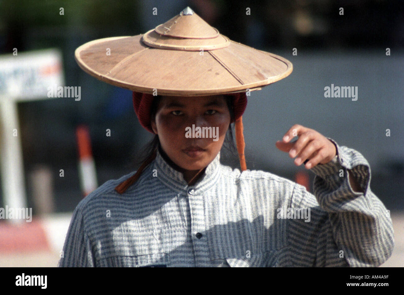 Portrait of a elderly Vietnamese woman wearing typical hat Stock Photo ...