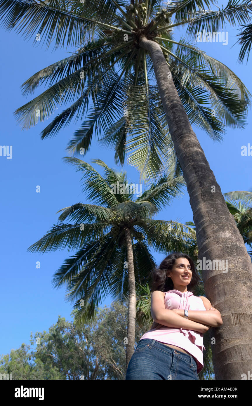 Female leaning against tree hi-res stock photography and images - Alamy