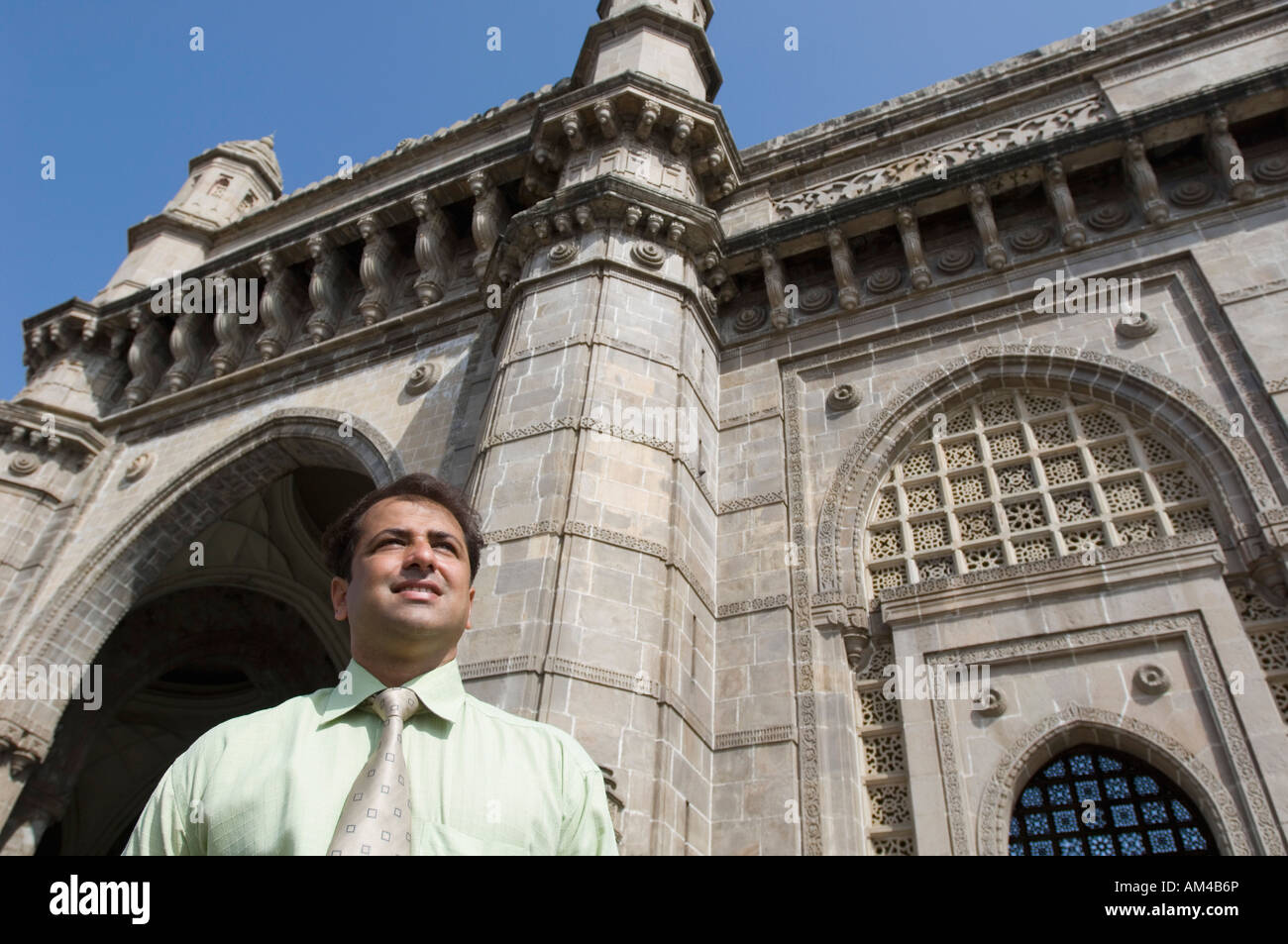 Low angle view of a businessman in front of a monument, Gateway of ...