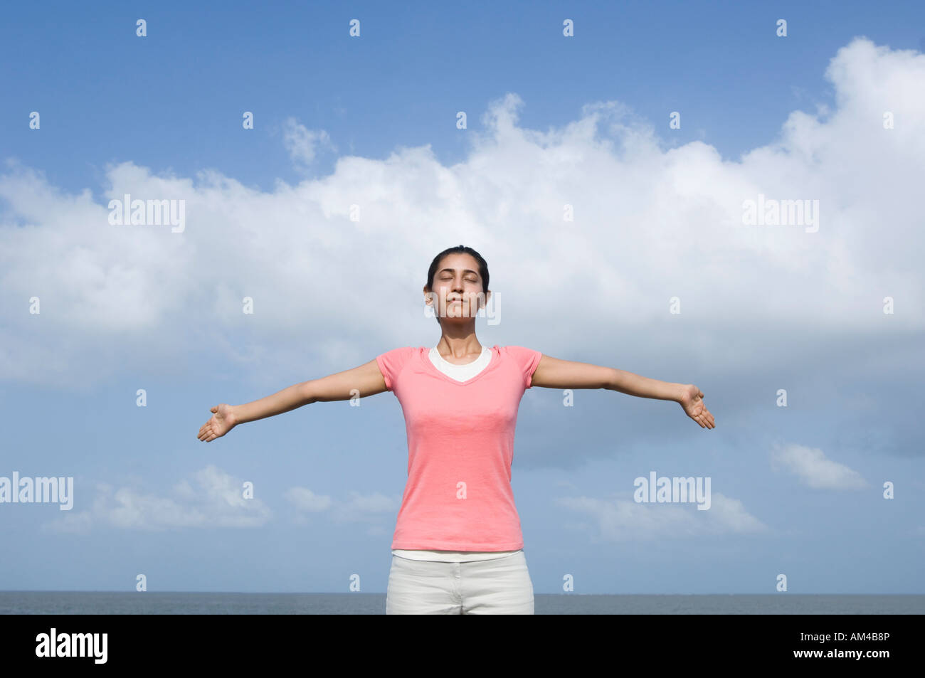 Indian woman stretching arm hi-res stock photography and images - Alamy