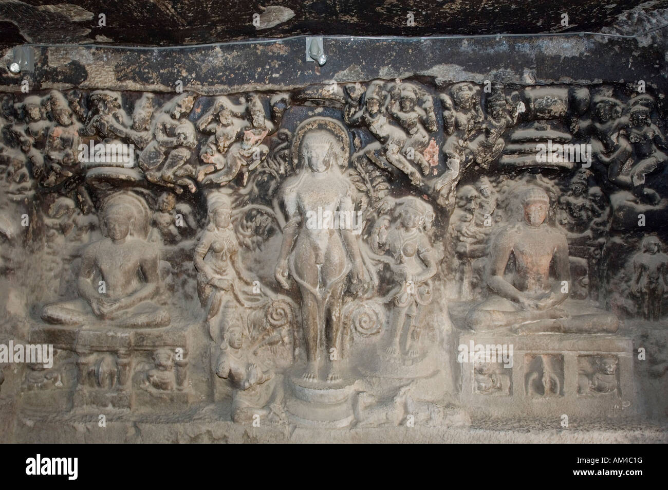 Statues carved in a cave, Ellora, Aurangabad, Maharashtra, India Stock ...