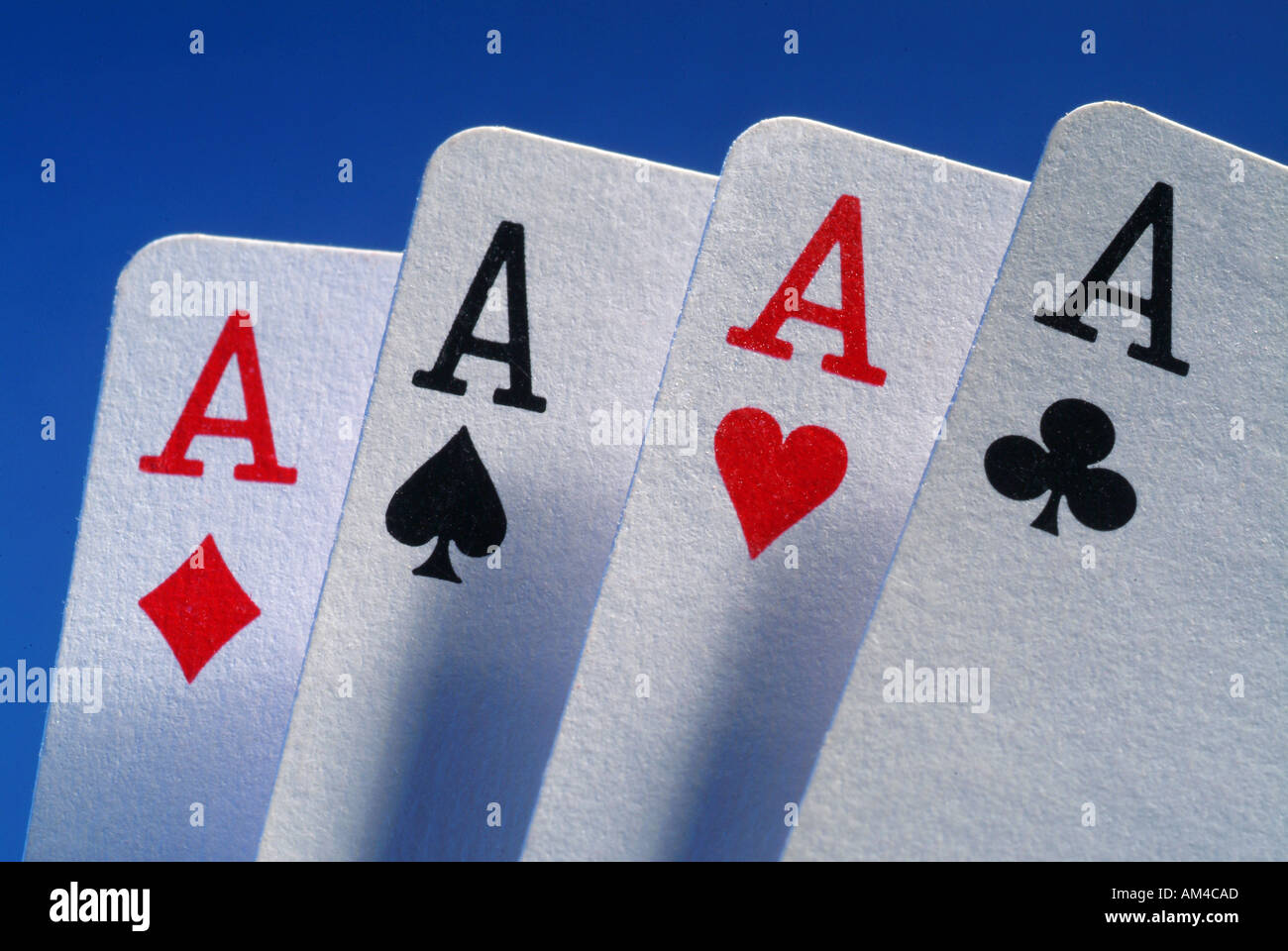 A hand of cards showing four Aces Stock Photo - Alamy