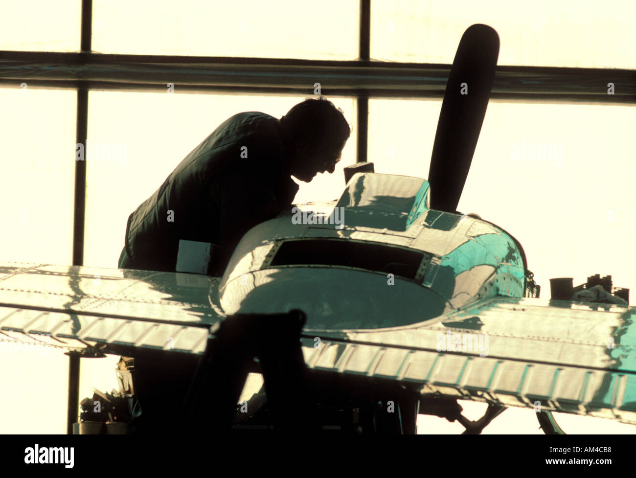 plane mechanic works on an engine Stock Photo - Alamy