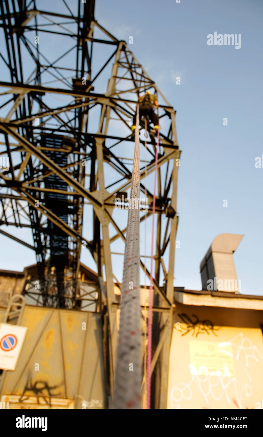 Fireman action climbing an iron pylon with rope training in the Firemen ...