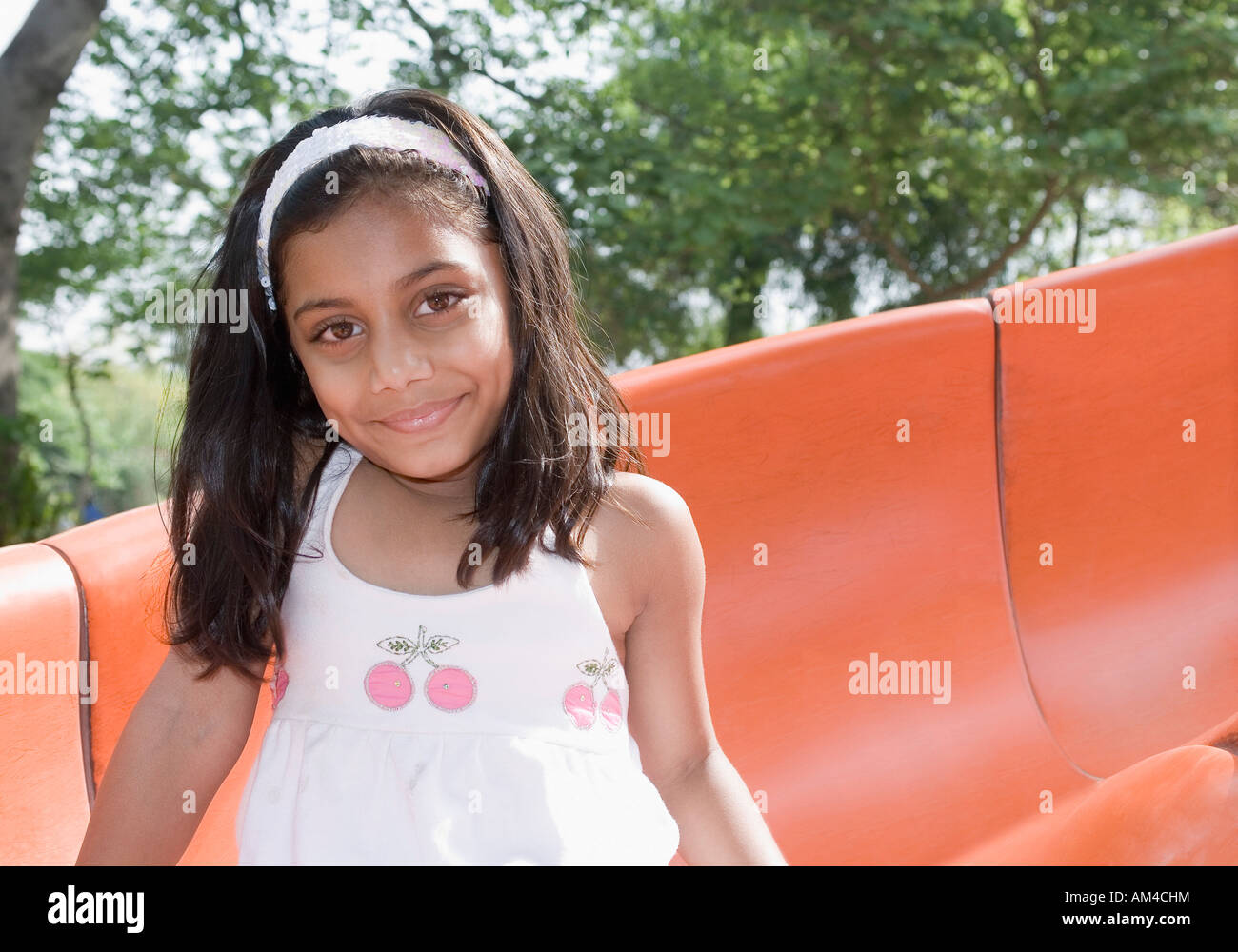 Portrait of a girl smirking Stock Photo - Alamy