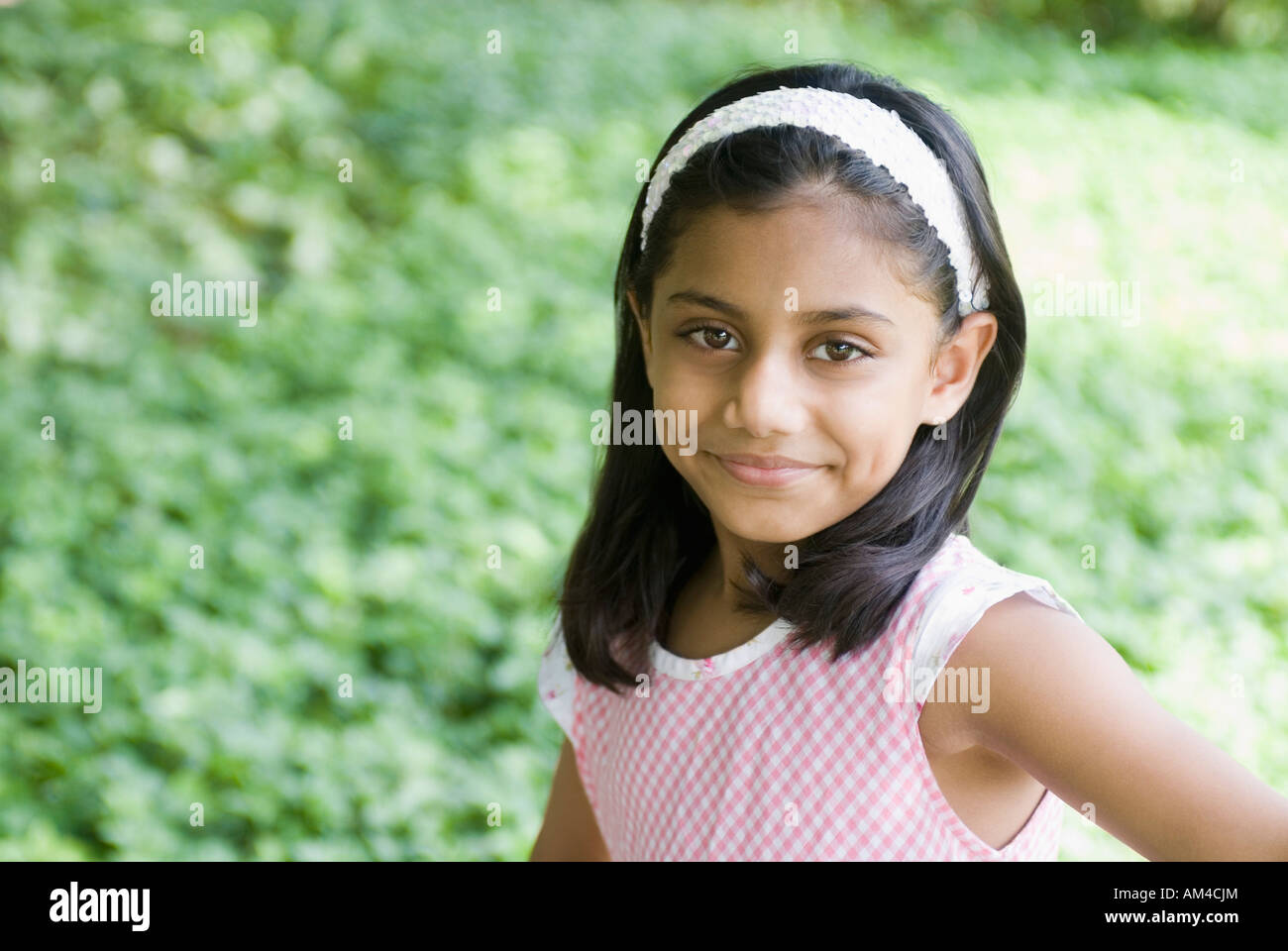 Portrait of a girl smirking Stock Photo - Alamy