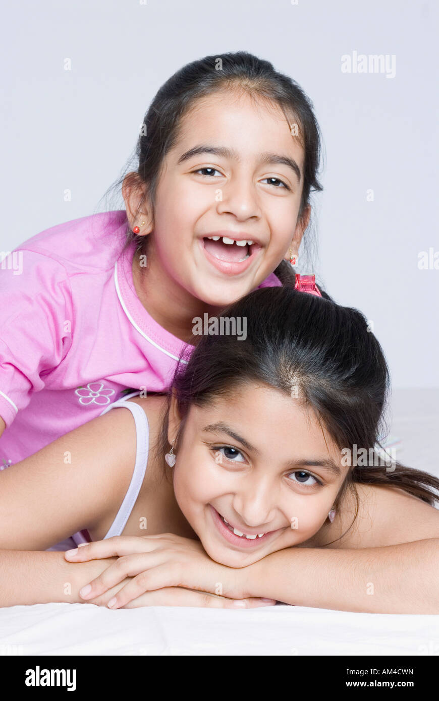 Portrait of two girls smiling Stock Photo - Alamy