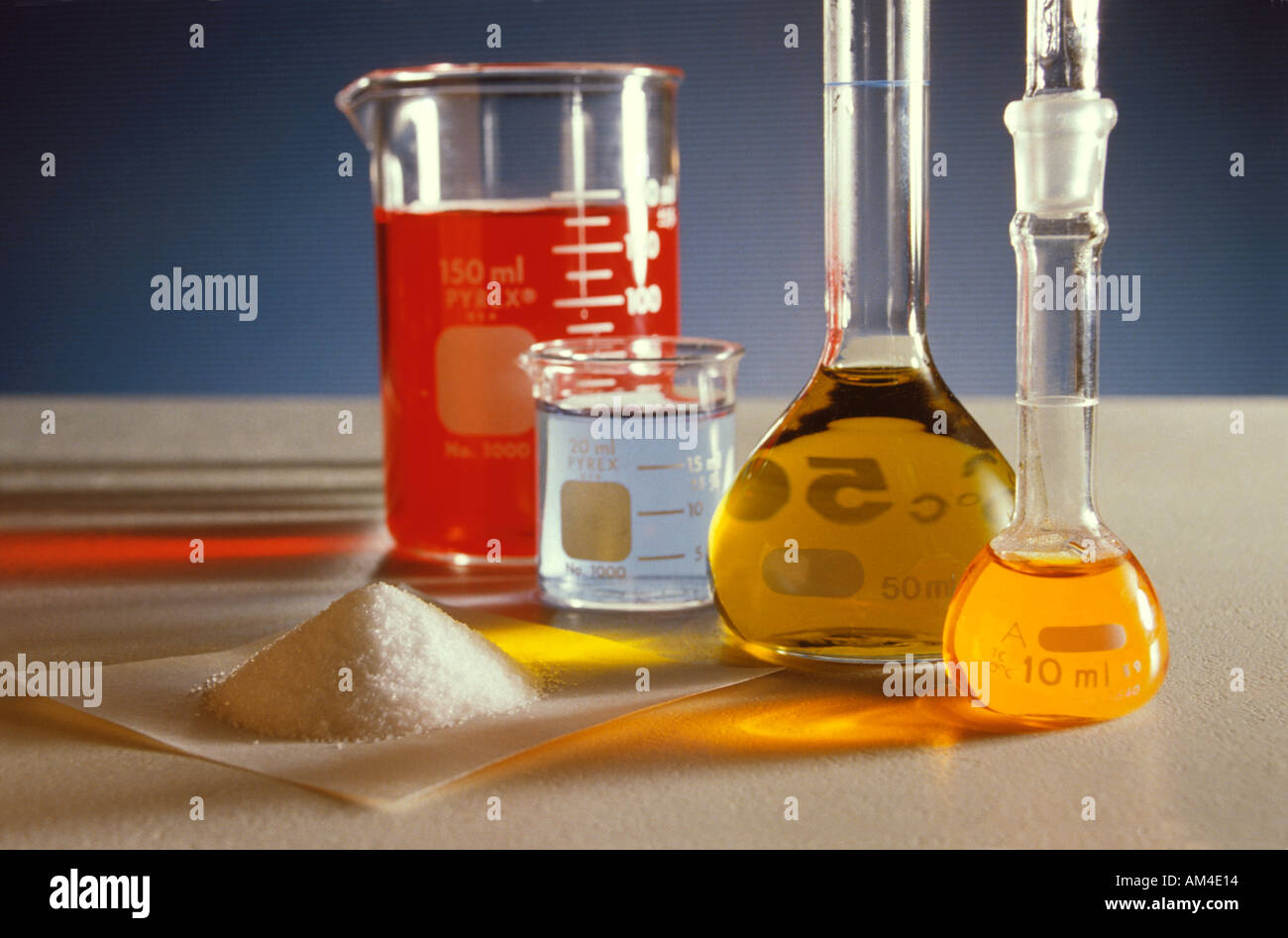 chemistry scene with beakers of colored liquids and powders Stock Photo ...