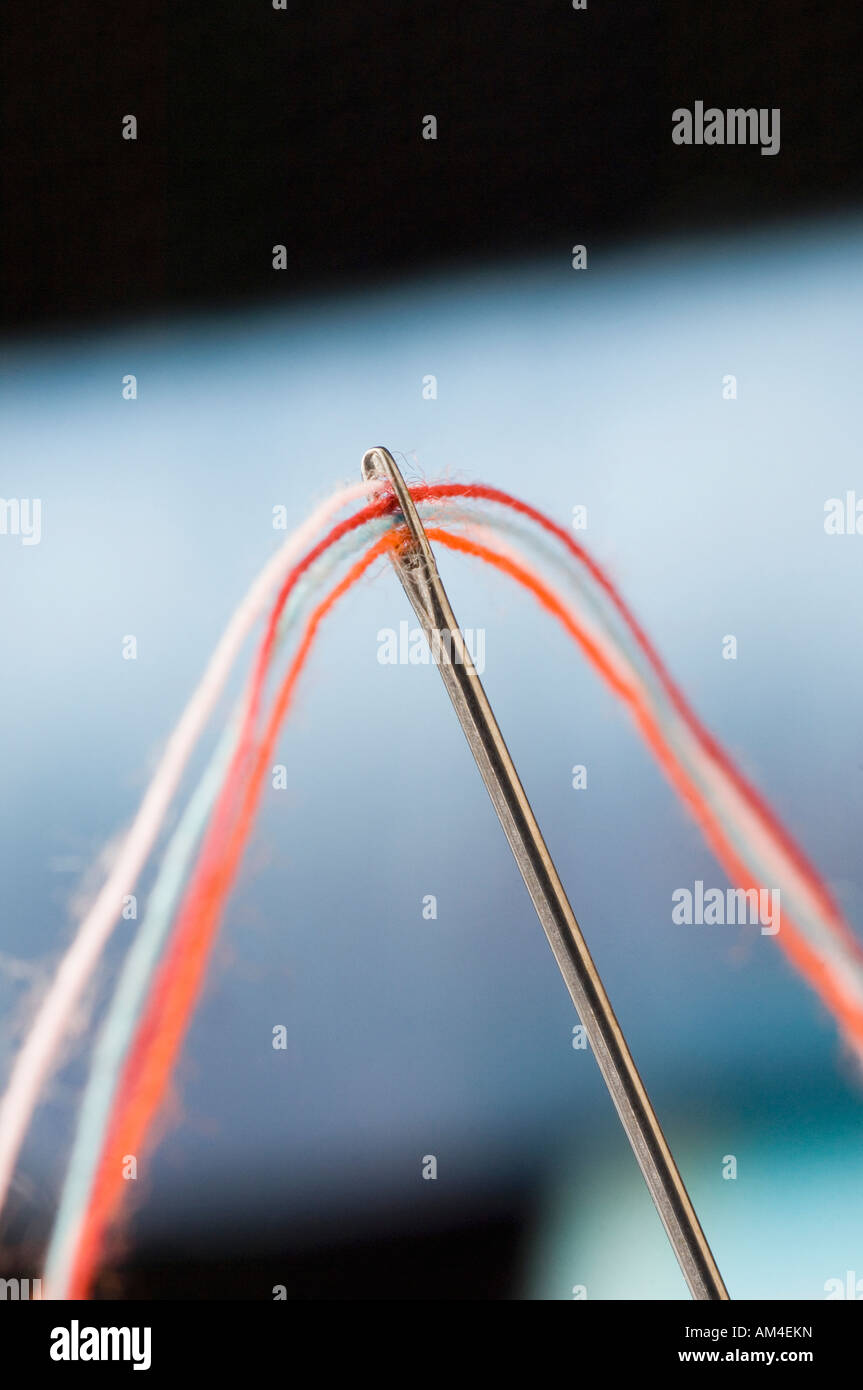 Close-up of a needle and threads Stock Photo - Alamy