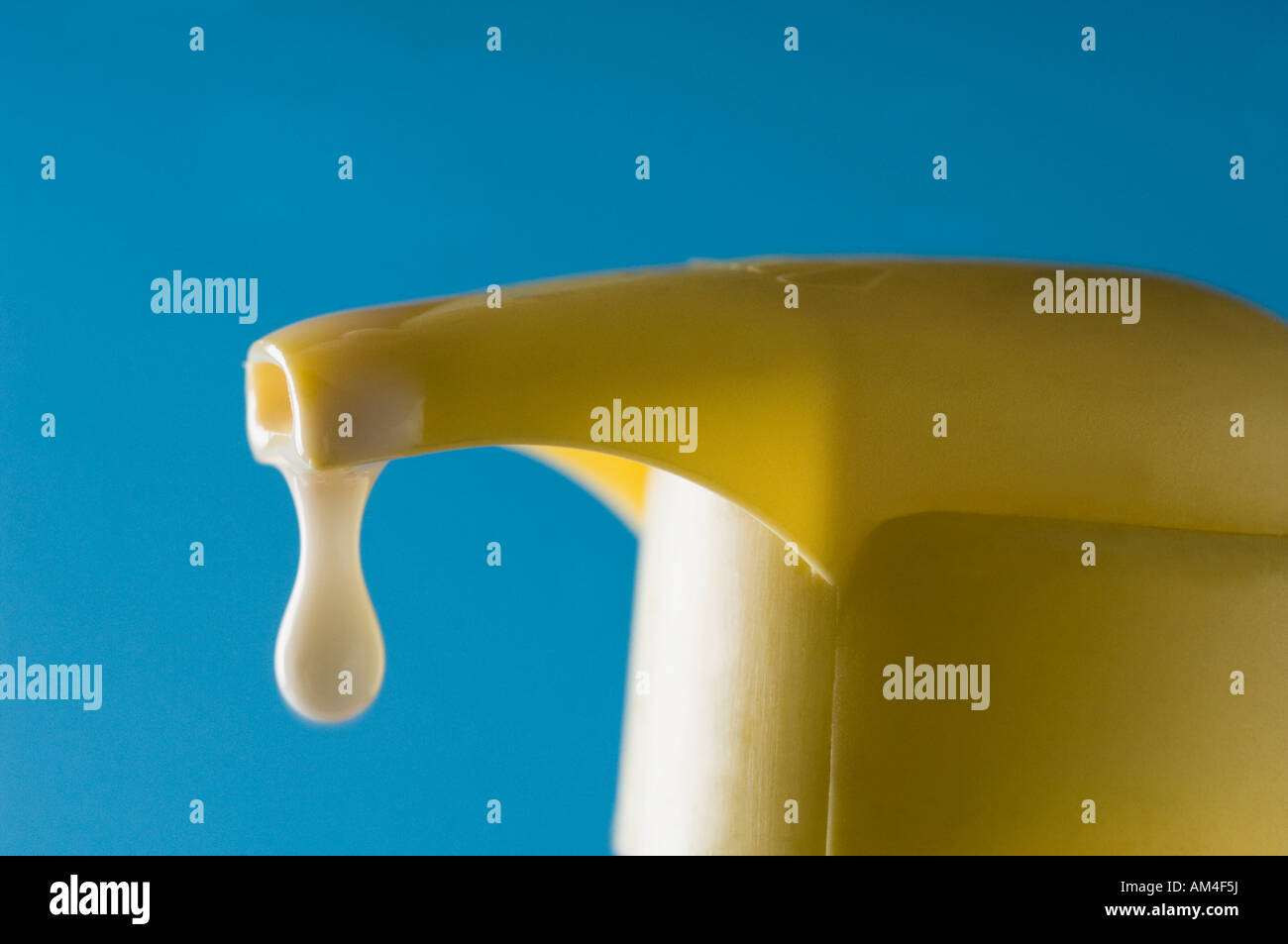 Close-up of a moisturizer drop falling from a soap dispenser Stock ...