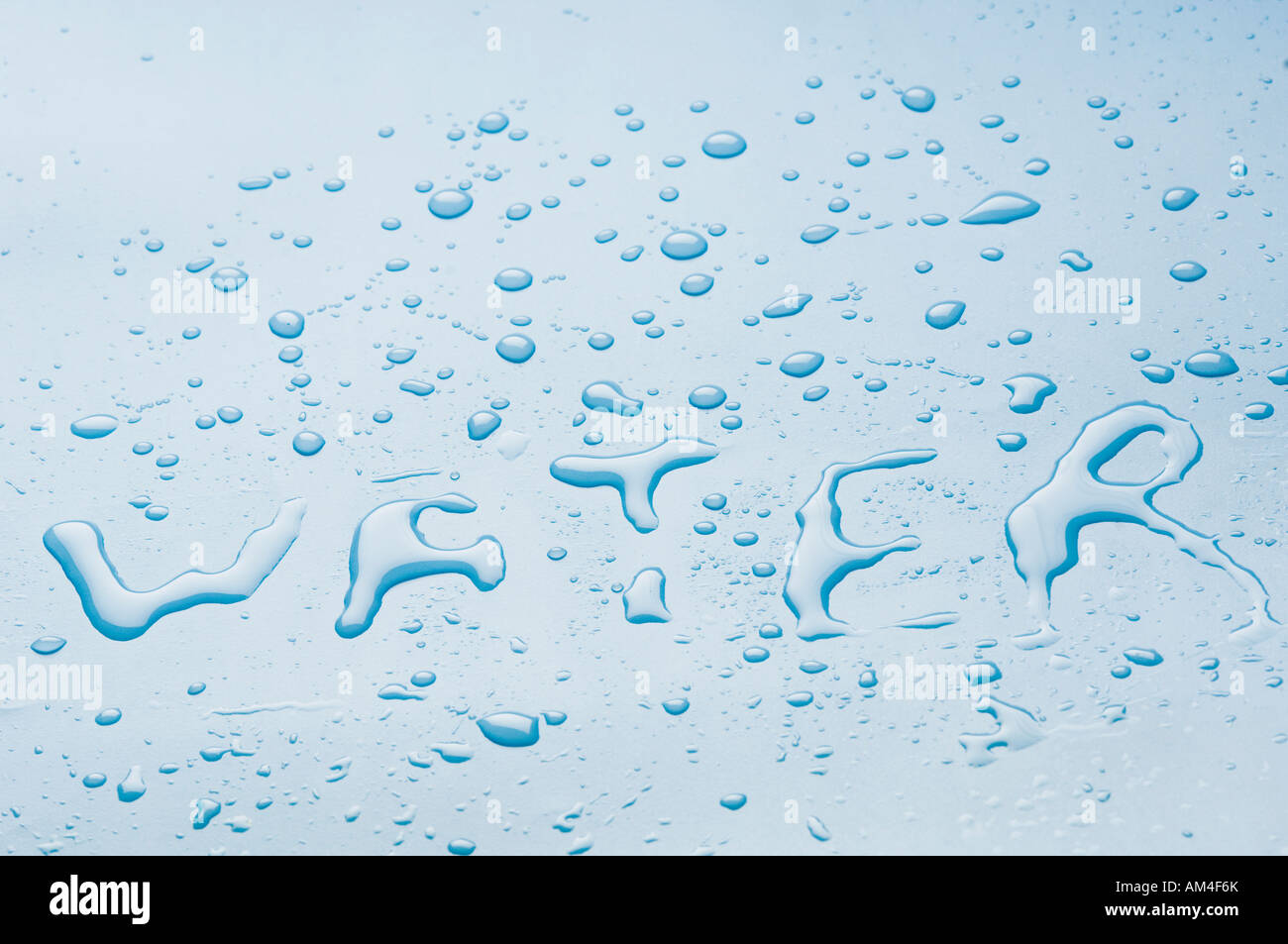Water written with water droplets Stock Photo - Alamy