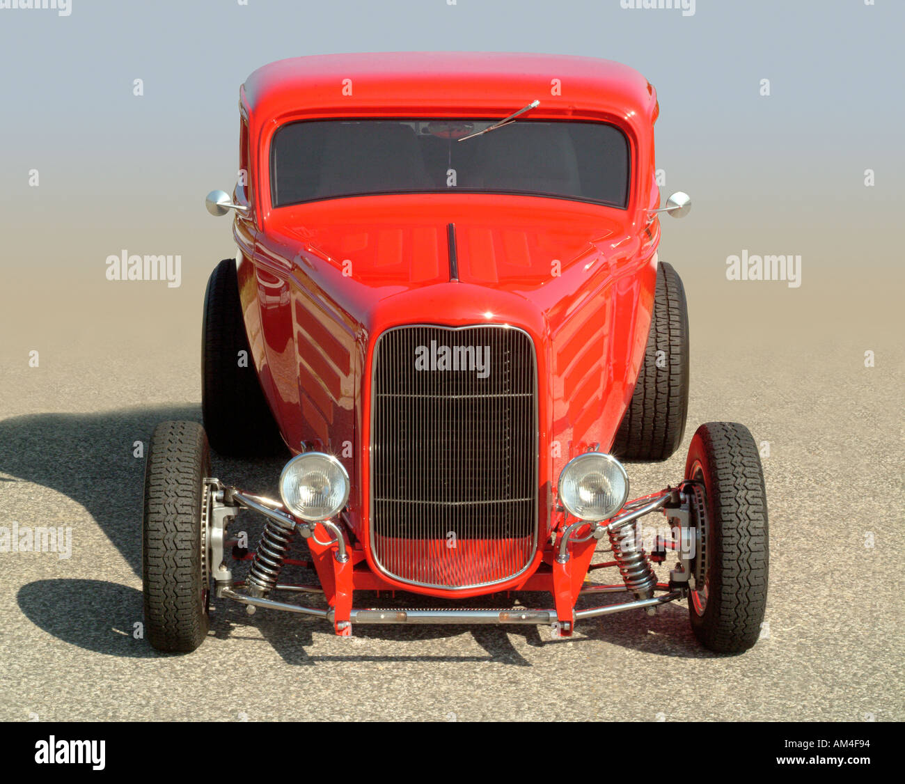 red hot rod with the fenders removed to accommodate the large tires ...