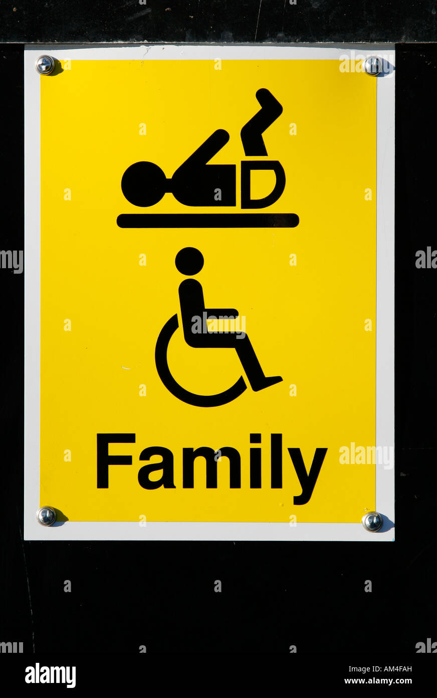 Disabled and child changing sign on door of public toilets Stock Photo ...