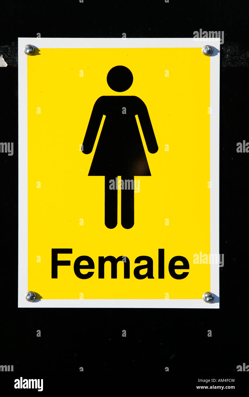 Female public toilets sign on black door Stock Photo - Alamy
