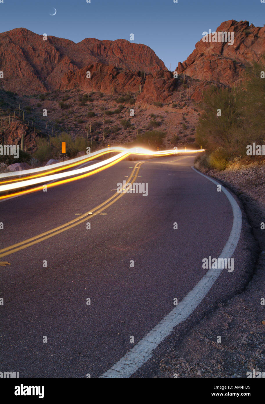 light trails from cars on a desert road in Arizona. This is Gates Pass ...