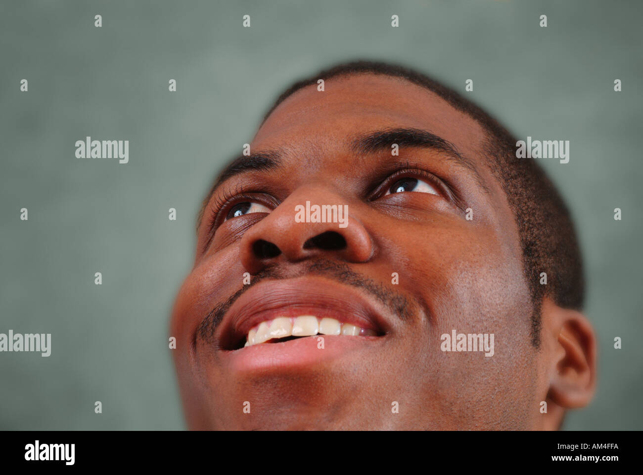 African American man mustache face close up smile cropped looking up ...
