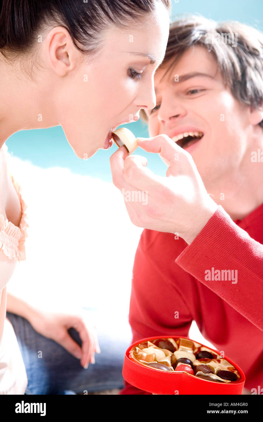 couple eating chocolates Stock Photo - Alamy