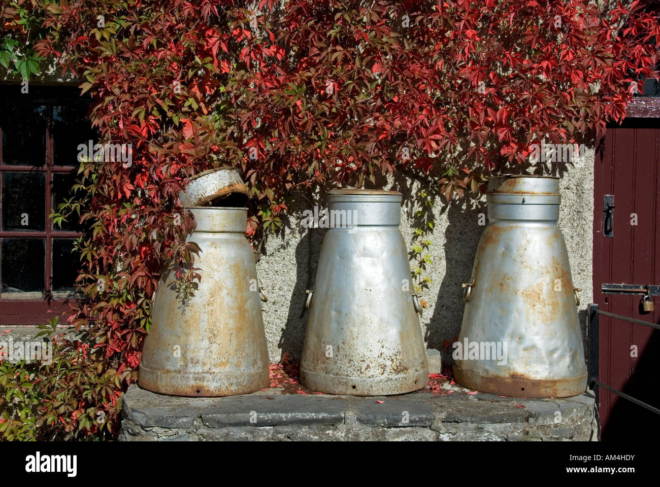 Old fashioned milk churns hi-res stock photography and images - Alamy