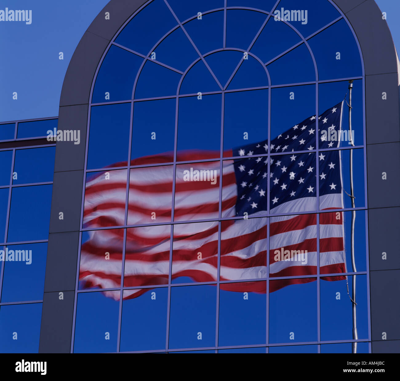 Office Building with American Flag reflected in windows Seattle ...