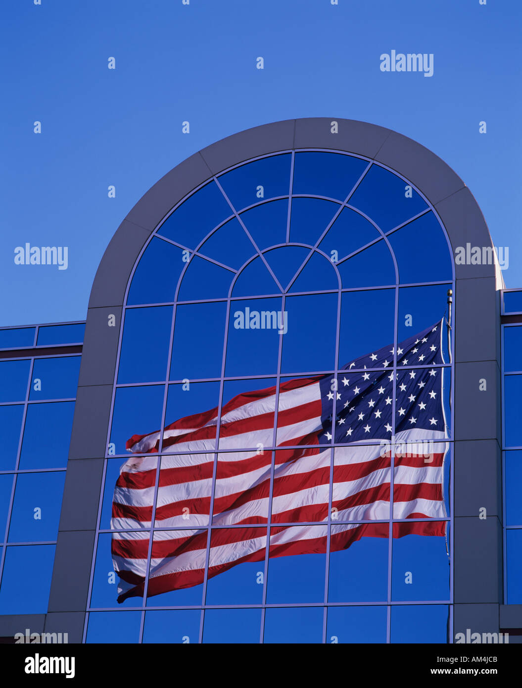 Office Building with American Flag reflected in windows Seattle ...