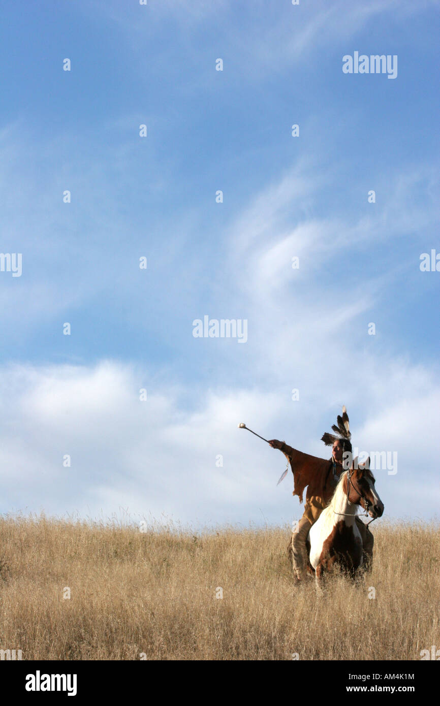 A Native American Indian man on horseback scouting for enemies or ...