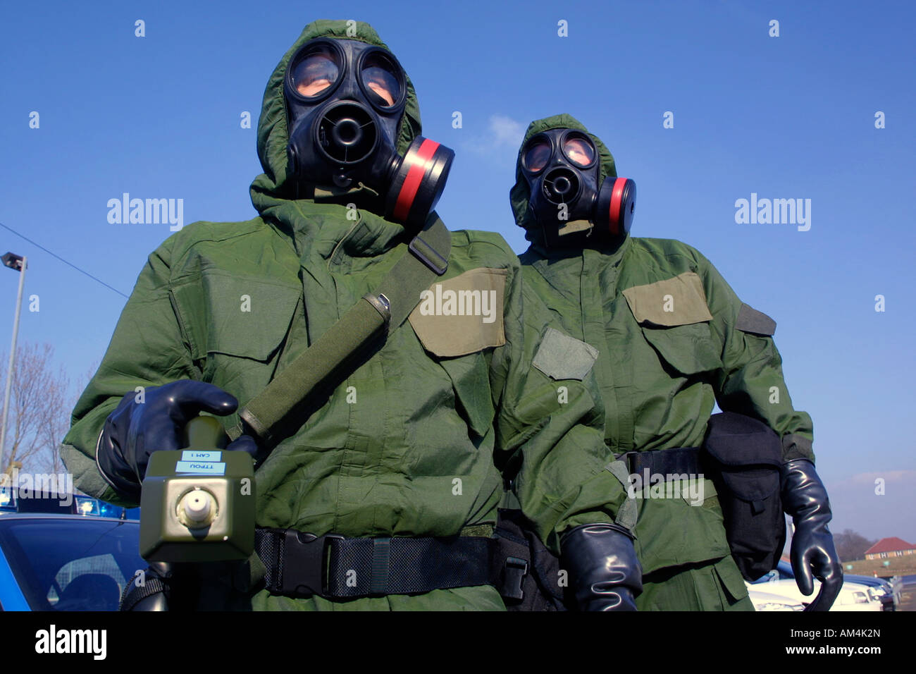 British Policemen wearing bioterrorism protection suits and carrying ...