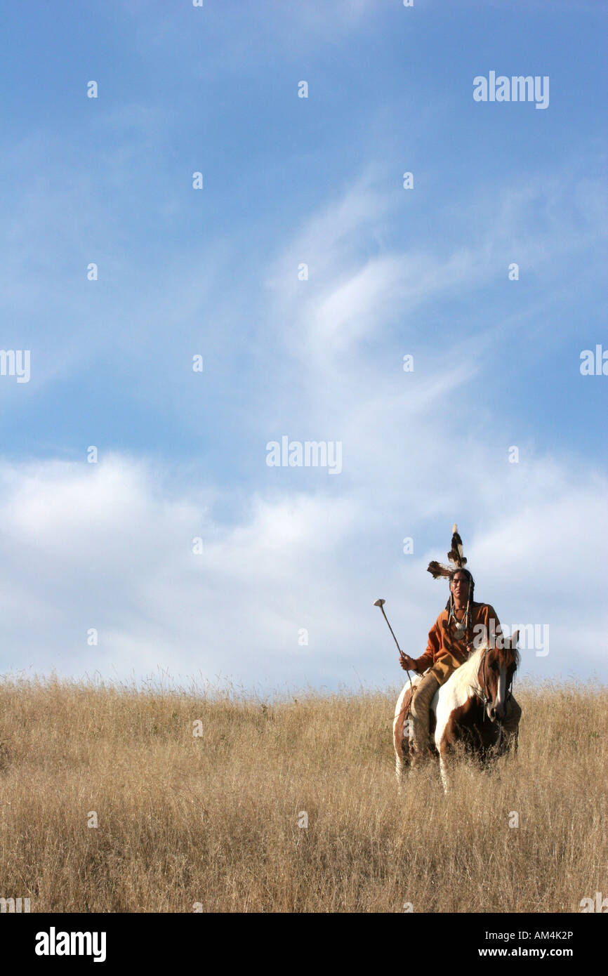 A Native American Indian man on horseback scouting for enemies or ...