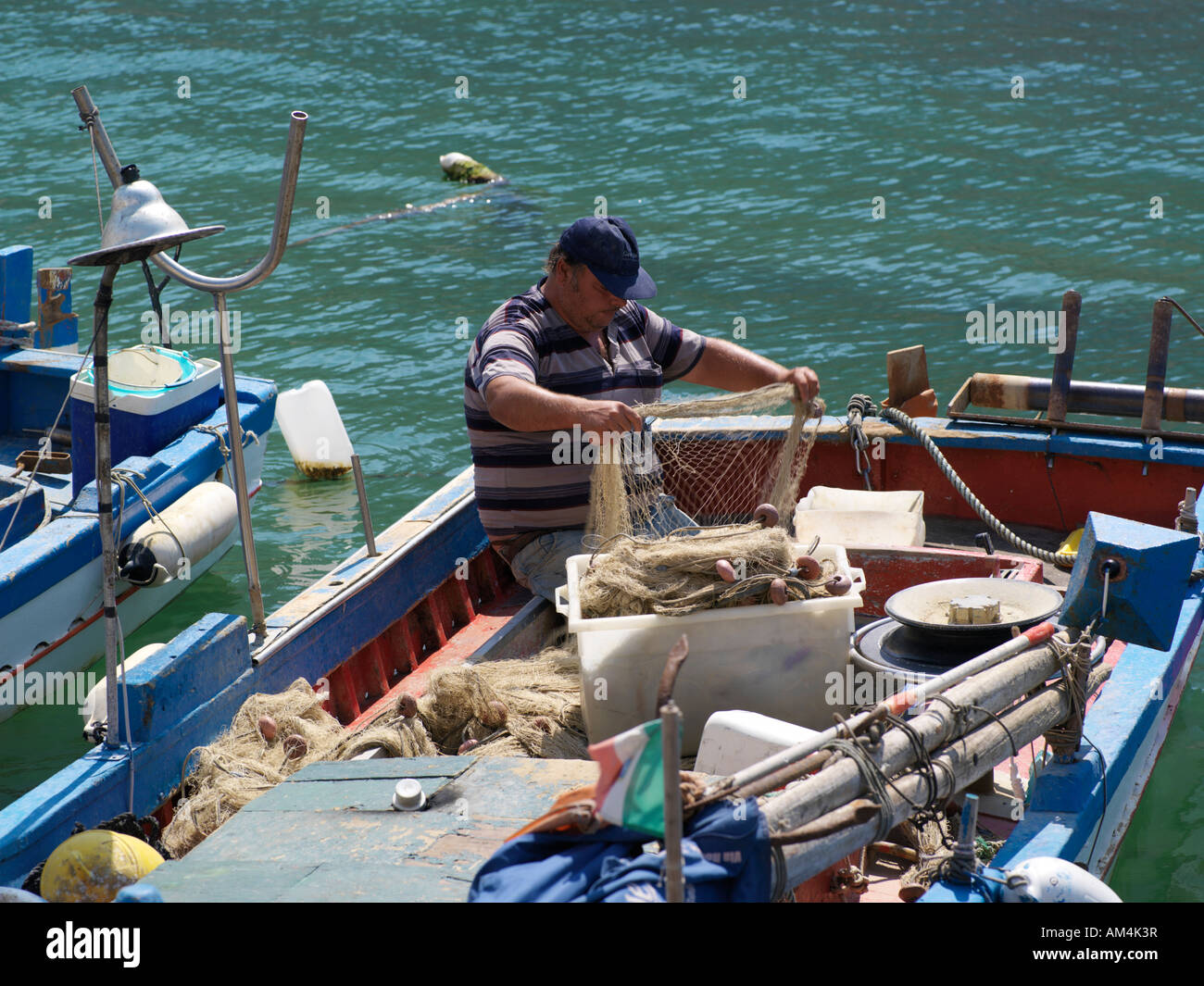 Fisherman Checking Nets Castellanmare del Golfo Sicily Stock Photo - Alamy