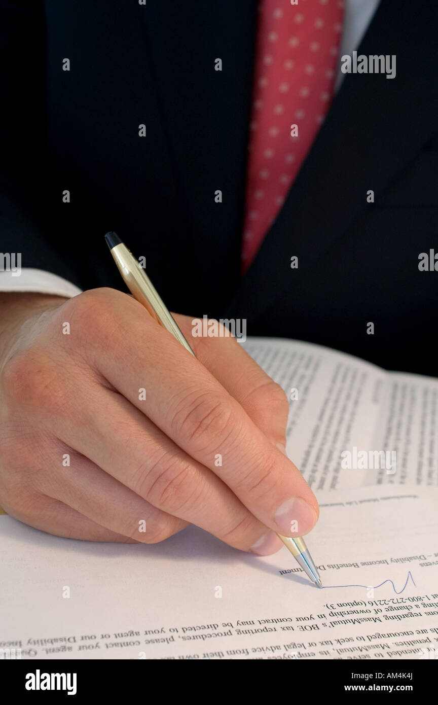 Mans hand signing document hi-res stock photography and images - Alamy