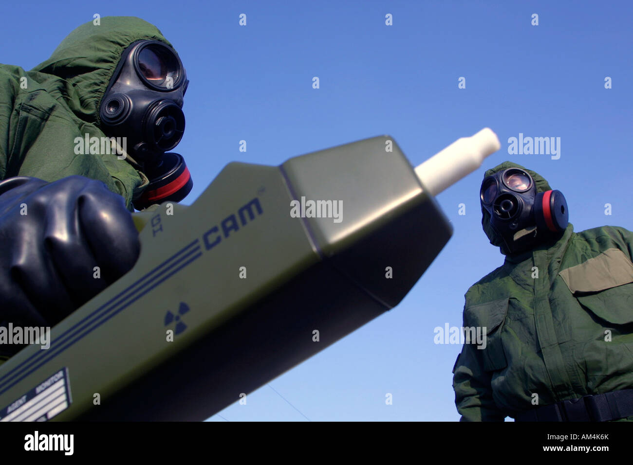 British Policemen wearing bioterrorism protection suits and carrying ...