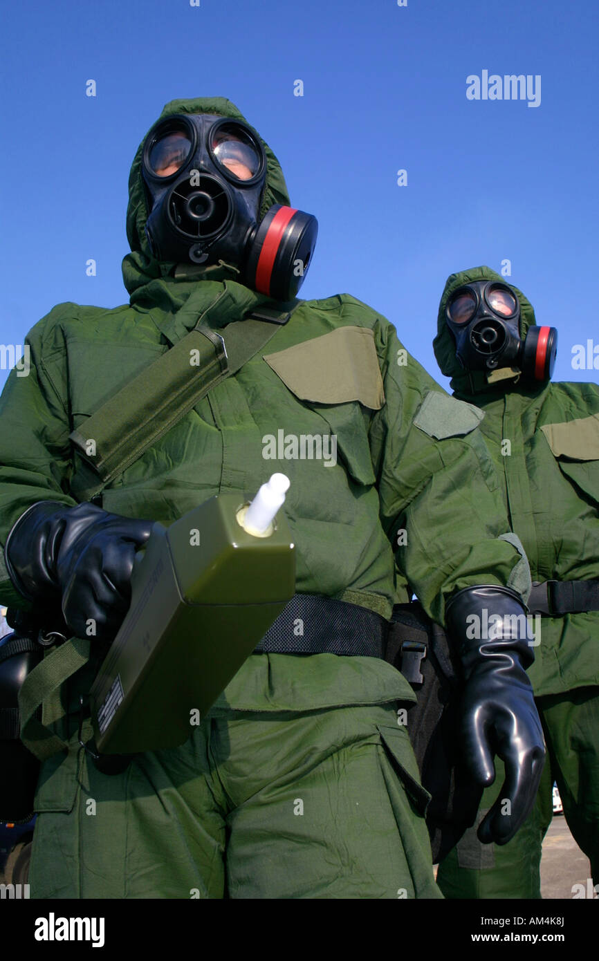 British Policemen wearing bioterrorism protection suits and carrying ...
