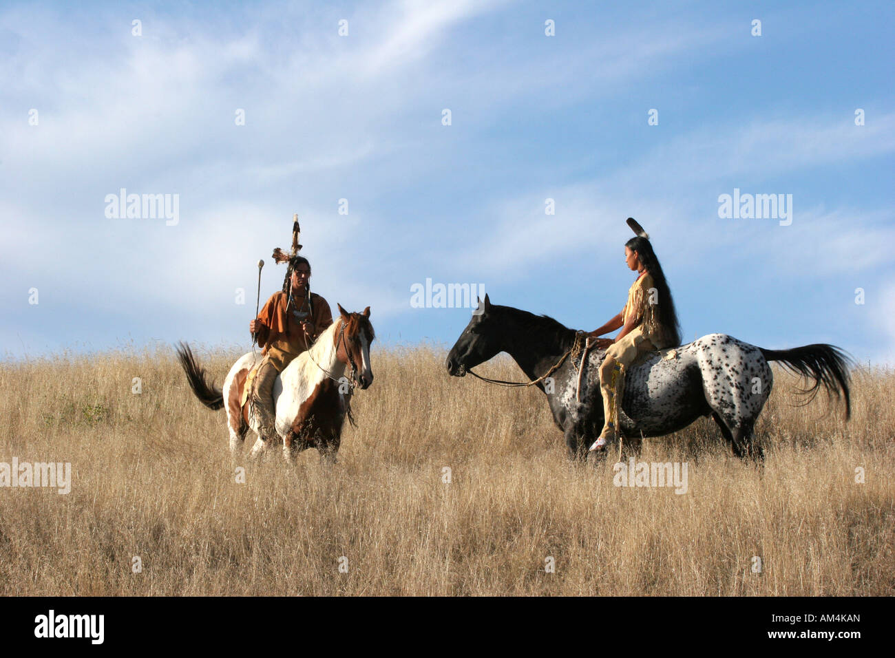 Two Native American Indian men on horseback scouting for enemies or ...