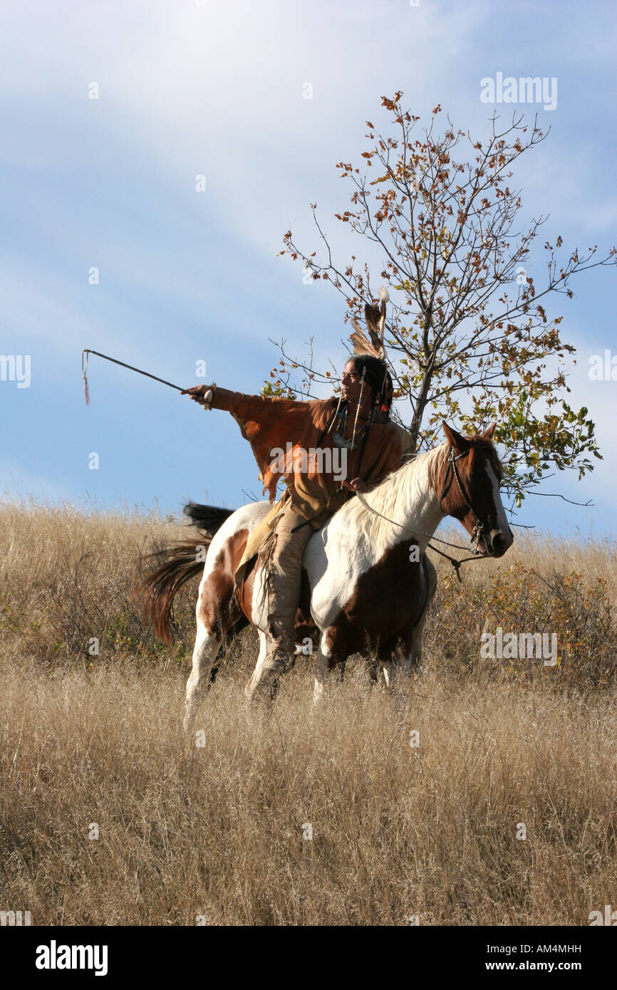 A Native American Indian man on horseback scouting for enemies or ...