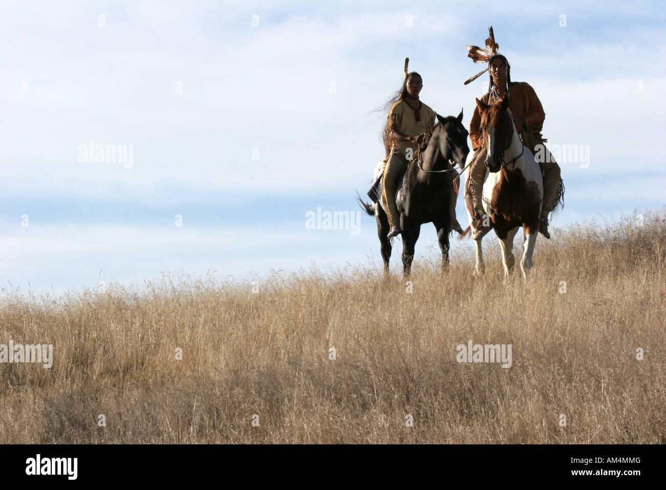Two Native American Indian men on horseback scouting for enemies in the ...