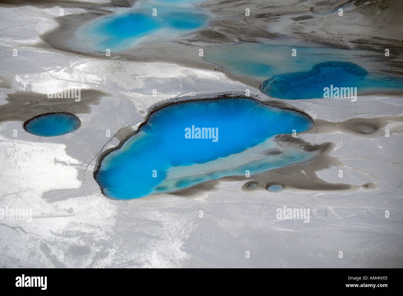 Aerial view of silt and turquoise water in an Alaska glacier Alaska ...