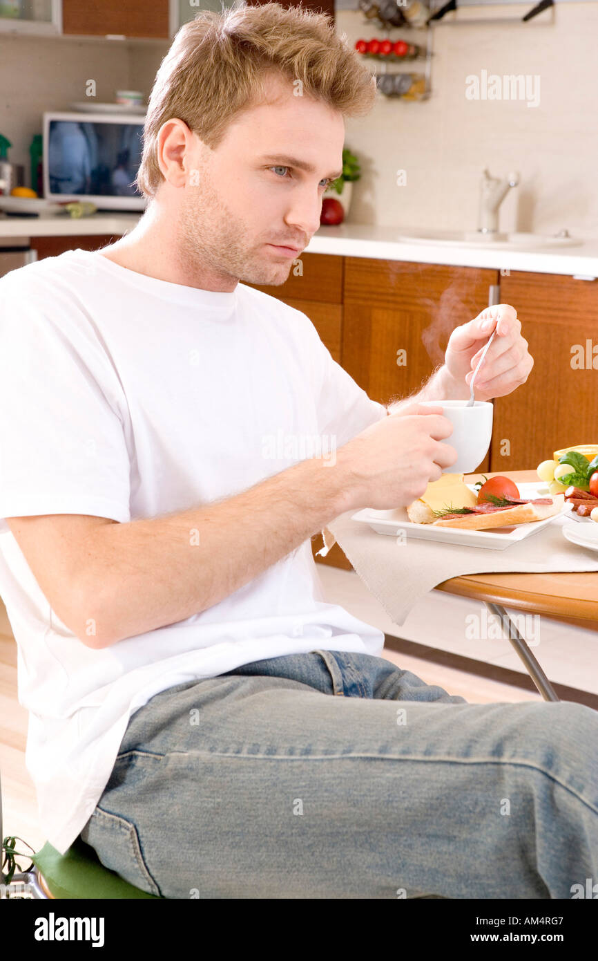 sad man during breakfast Stock Photo - Alamy