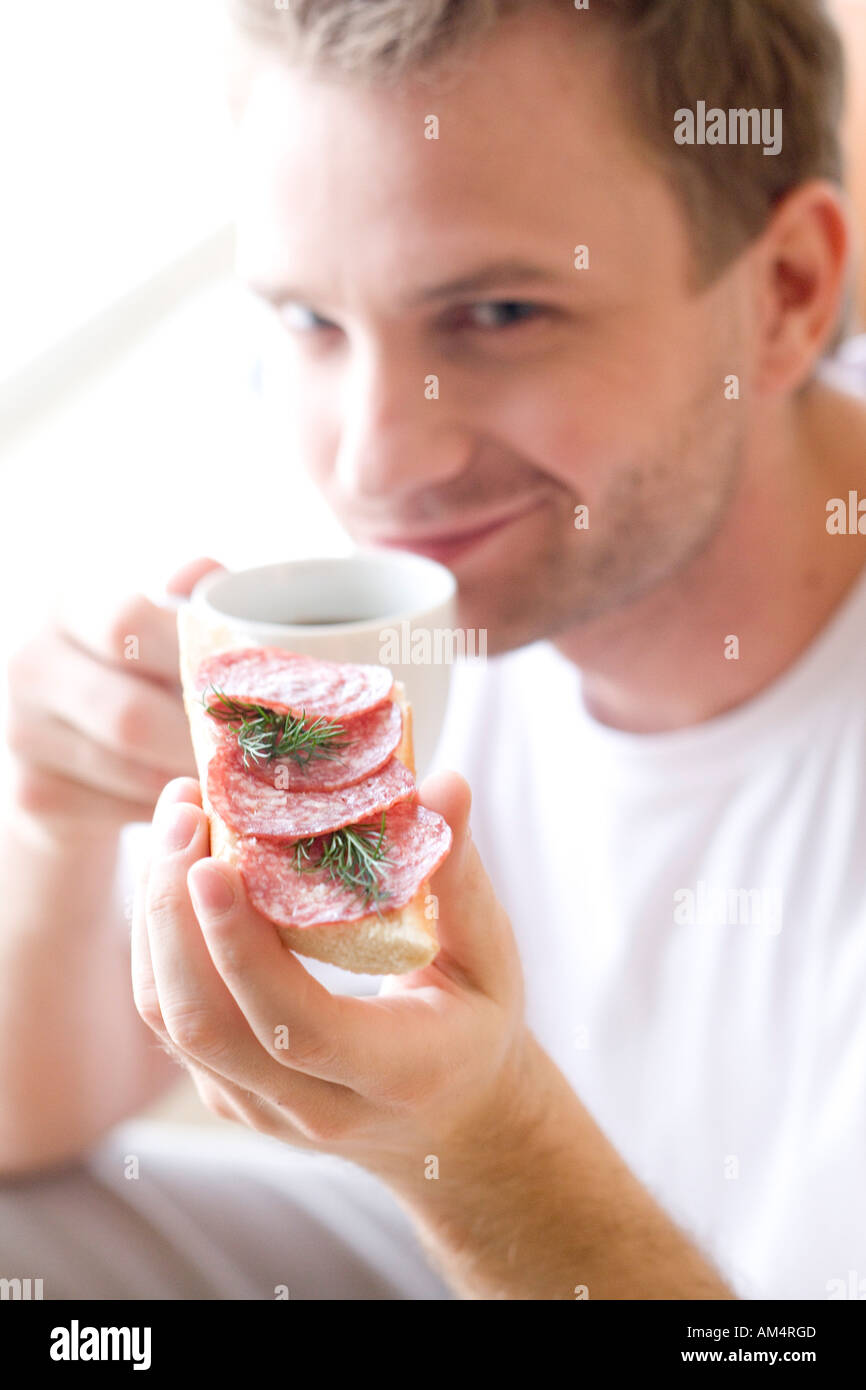 Holding eat eating salami ham hi-res stock photography and images - Alamy