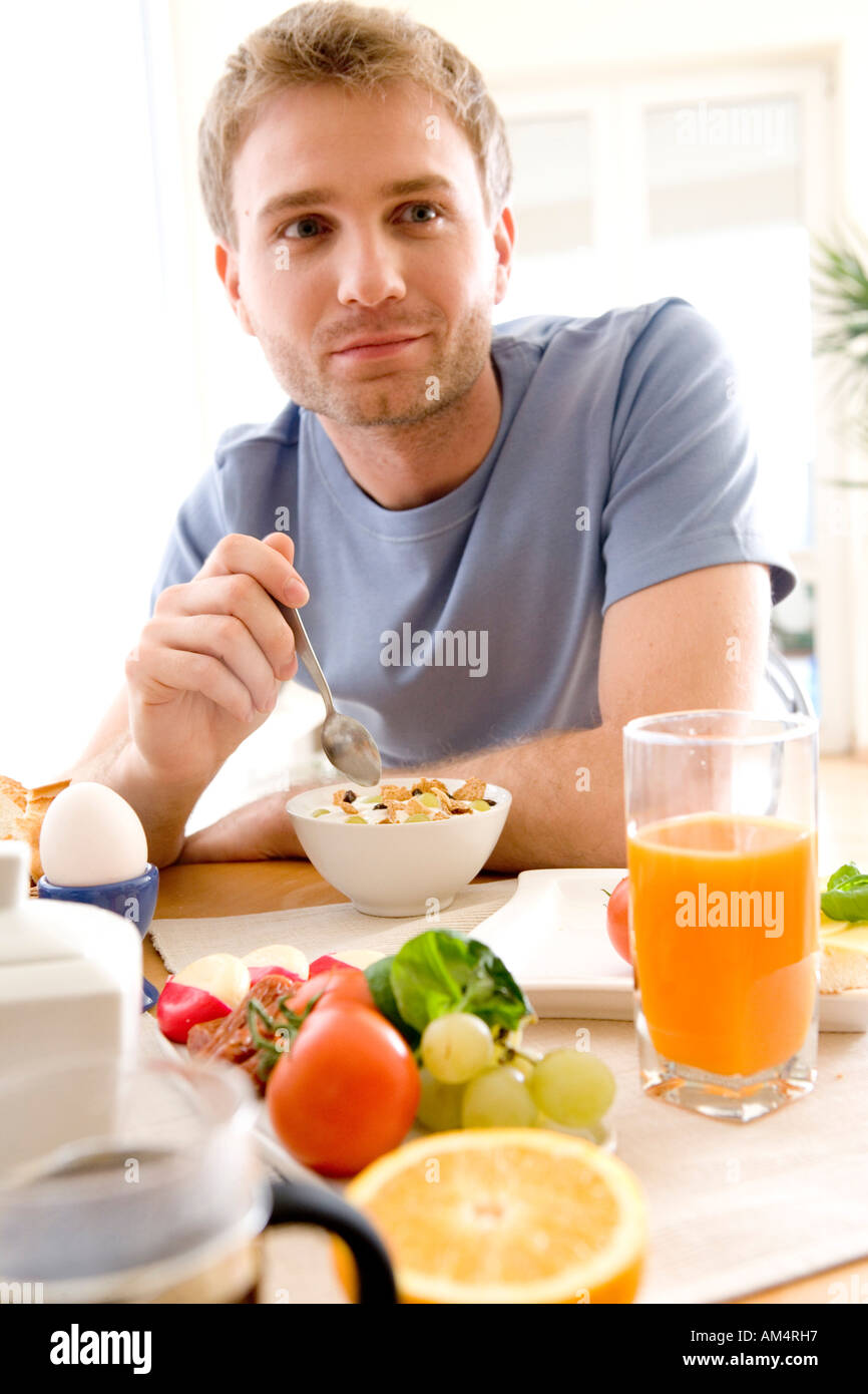 man eating breakfast cereals Stock Photo - Alamy