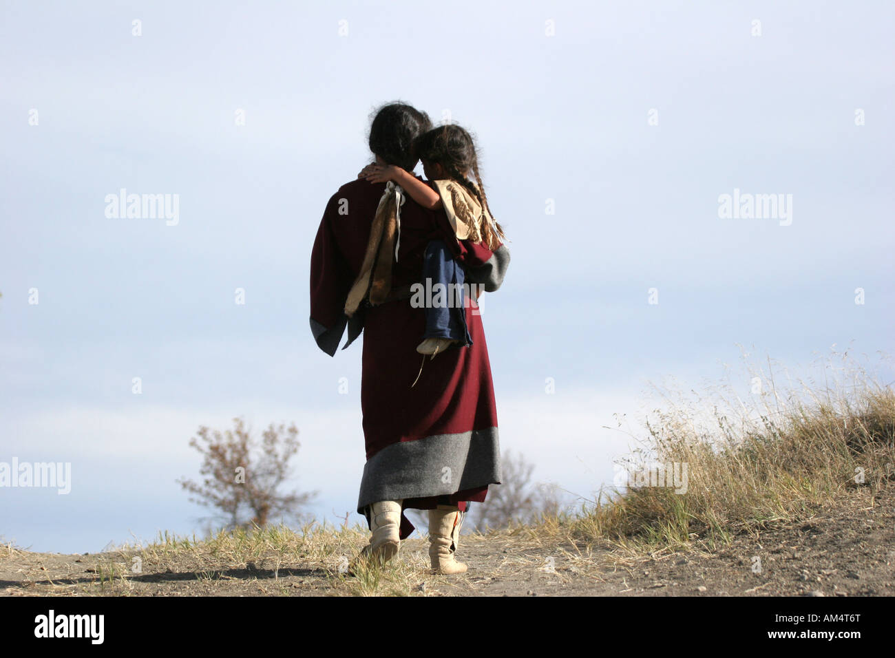 A young Native American Indian mom carrying her child Stock Photo - Alamy